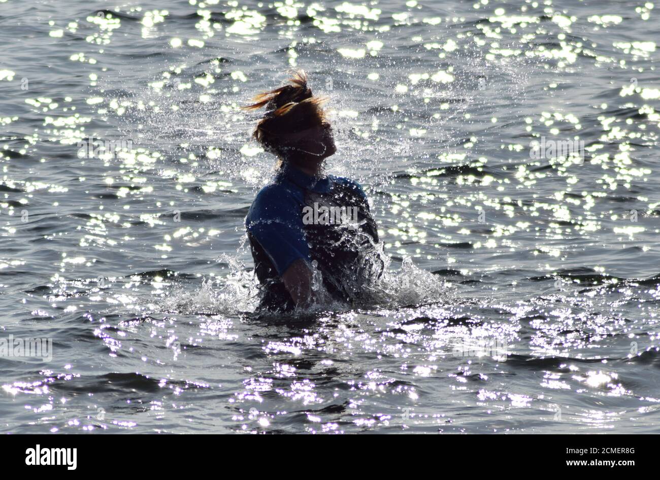 Swimmer breaking the surface 2 Stock Photo - Alamy