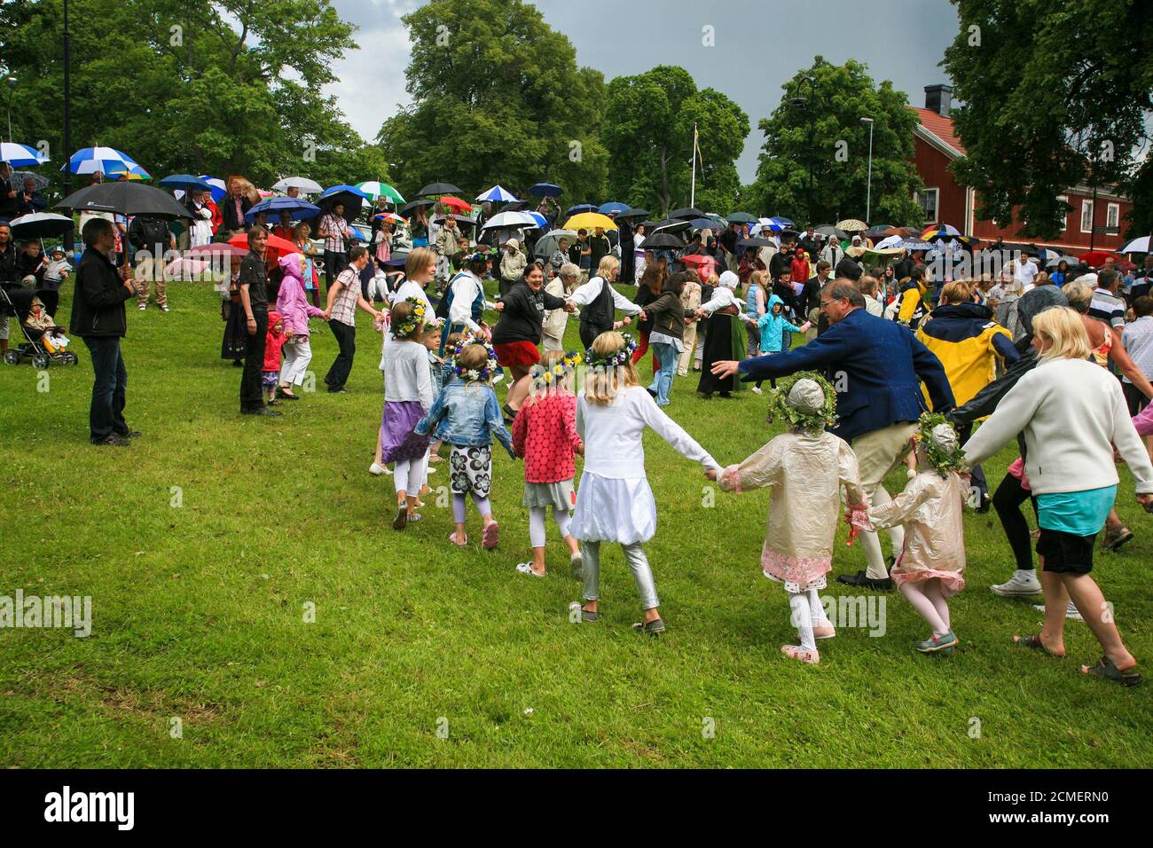MIDSUMMER DANCE around the maypole in drizzle Stock Photo - Alamy