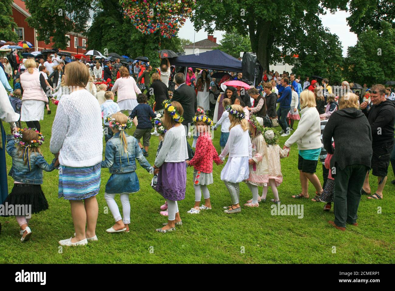 MIDSUMMER DANCE around the maypole in drizzle Stock Photo - Alamy