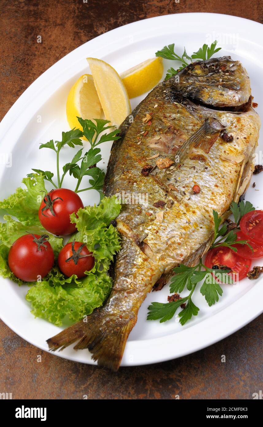 roasted fish Dorado Stock Photo - Alamy