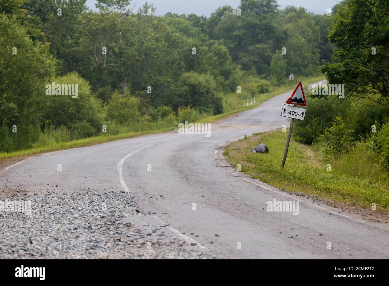 Very bad road in Russia. The asphalt road is all in holes in the middle ...