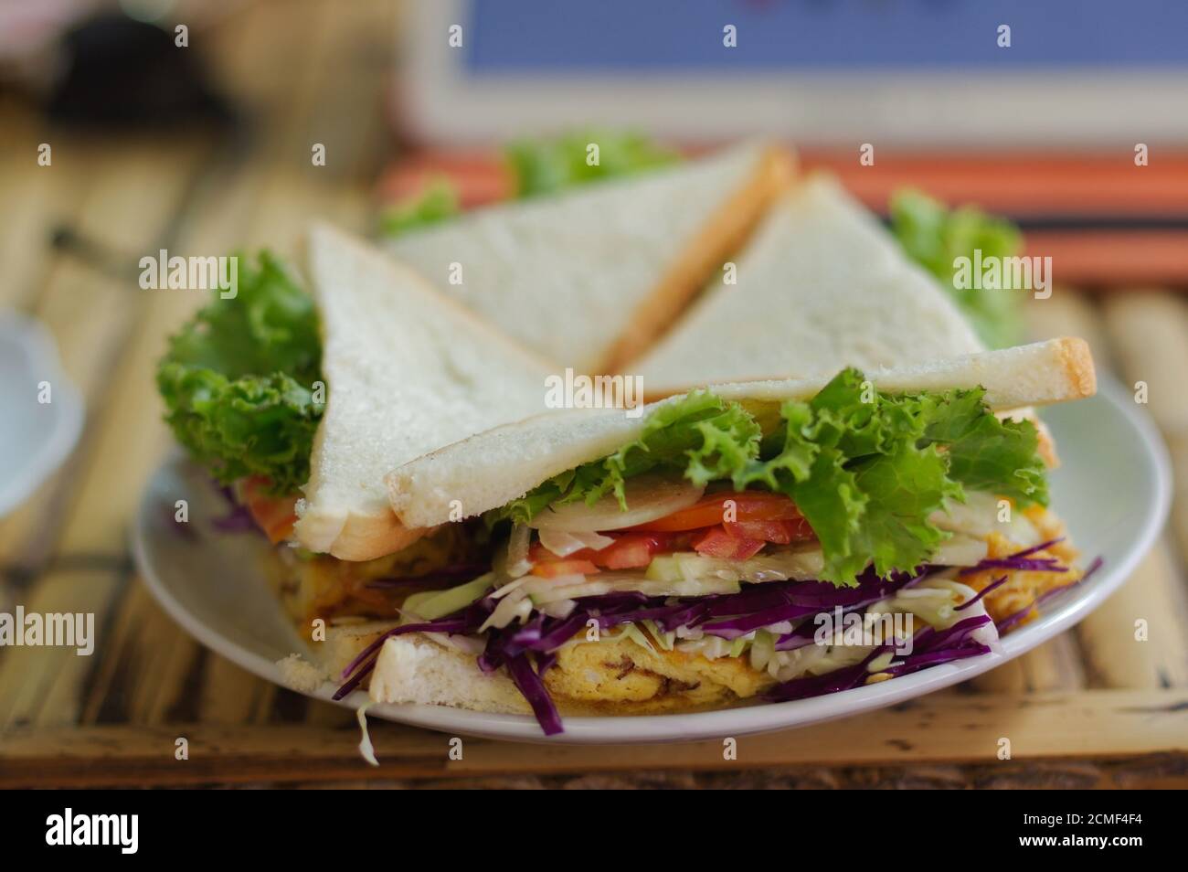 Vegetable triangle Sandwiches and crisps on a wooden table in ...