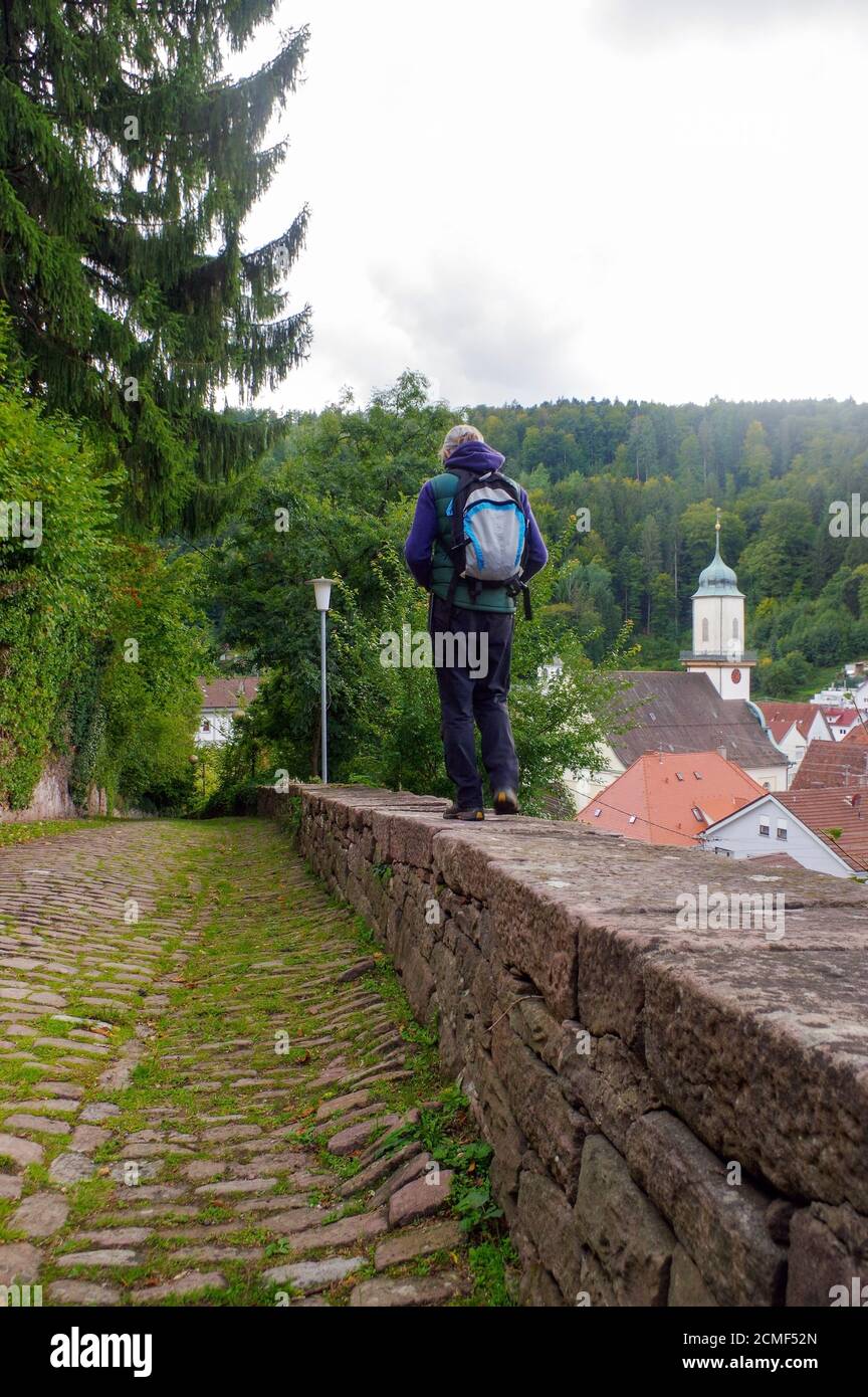 Man climbing over wall hi-res stock photography and images - Alamy