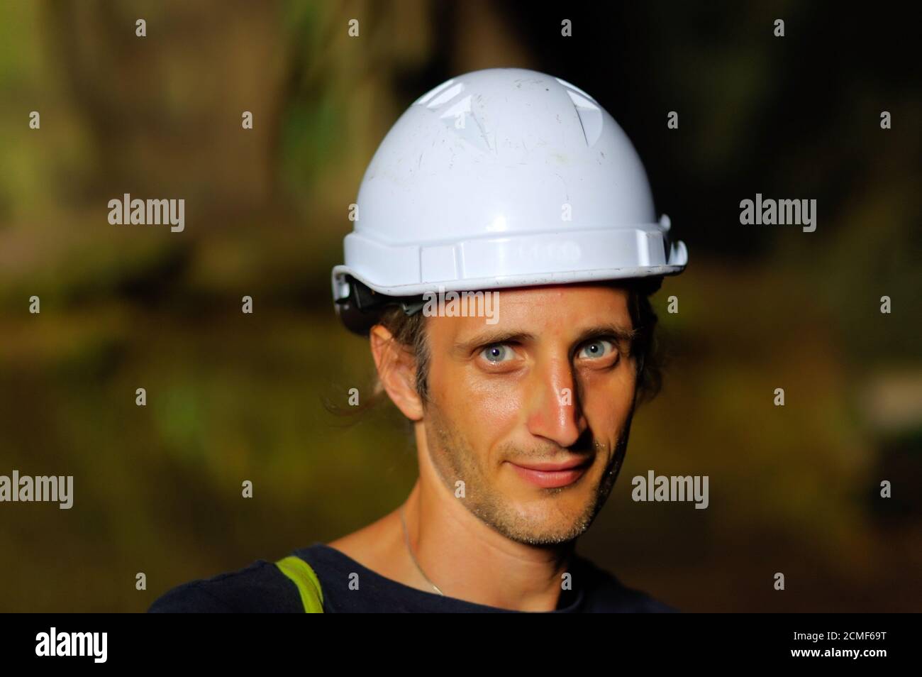 portrait of a worker with white helmet on head, nature background Stock ...