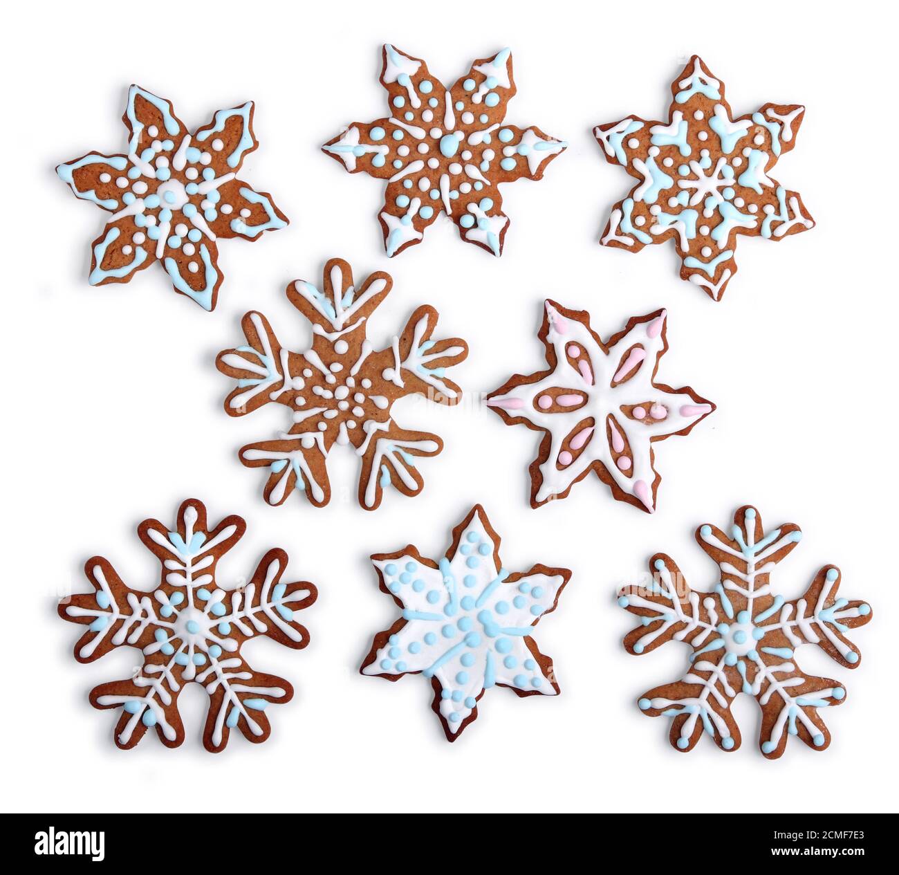 Homemade snowflake shaped gingerbread cookies with sugar icing, on ...