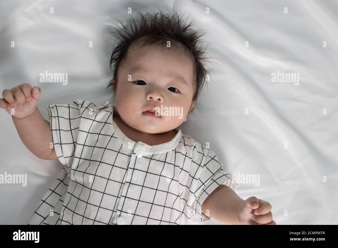 Portraiture image of Three month old Asian Cute little baby boy lsolated on white background ...