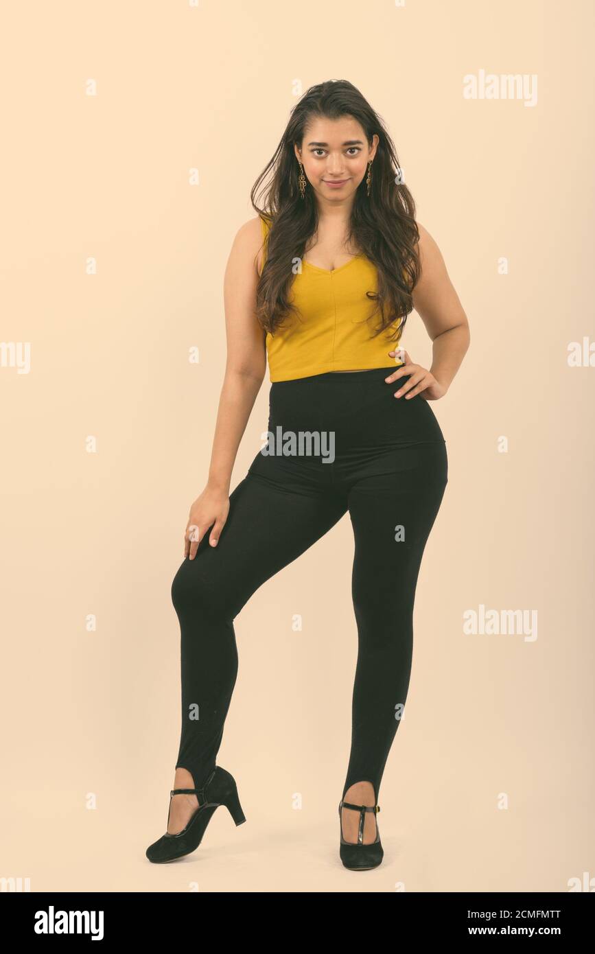 Full body shot of young beautiful Indian woman posing Stock Photo - Alamy