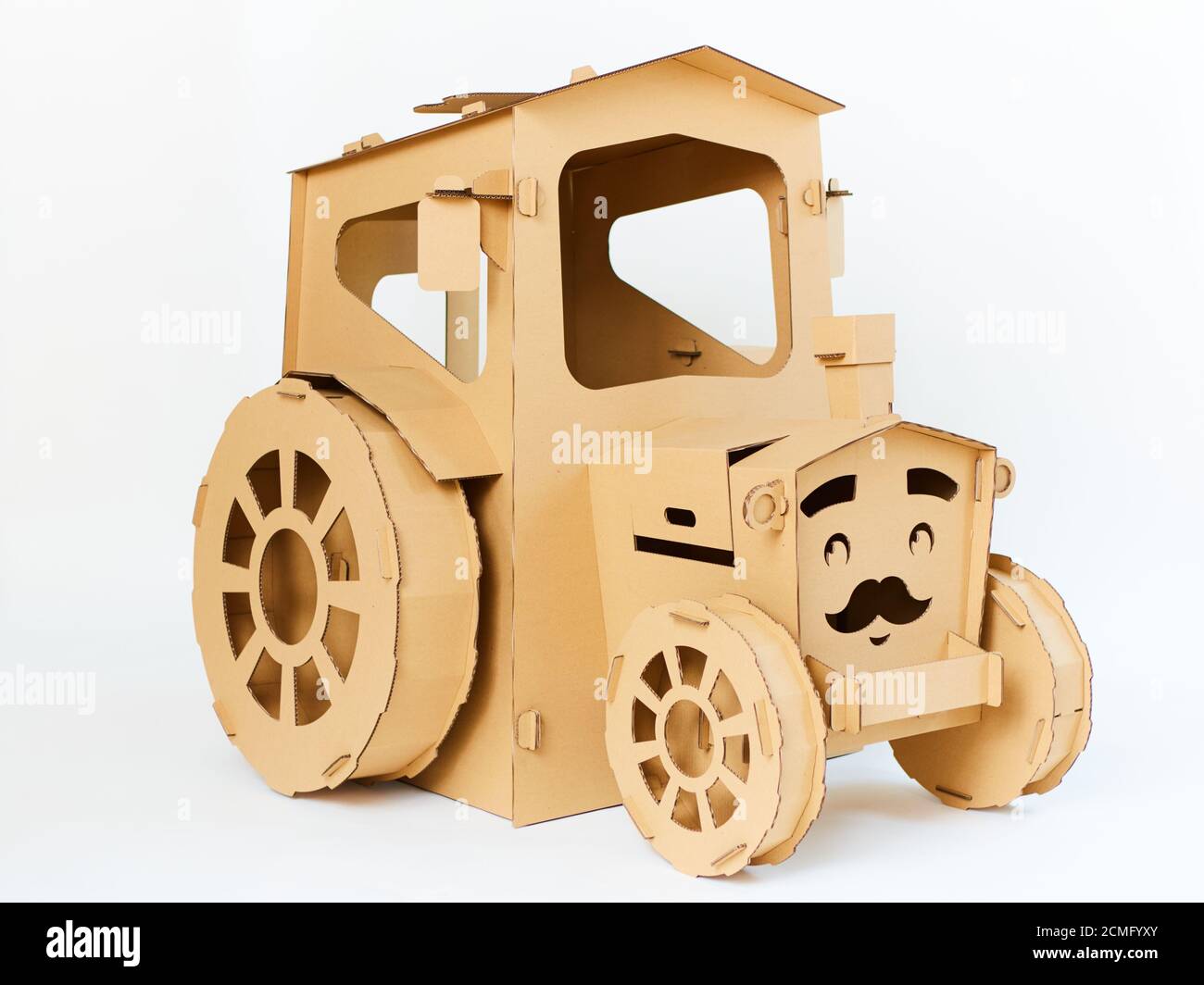 Cardboard tractor on a white background. Agriculture concept. Mockup ...