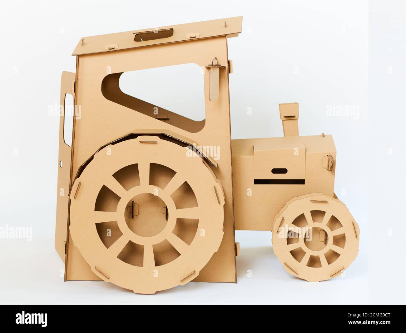 Cardboard tractor on a white background. Agriculture concept. Mockup ...