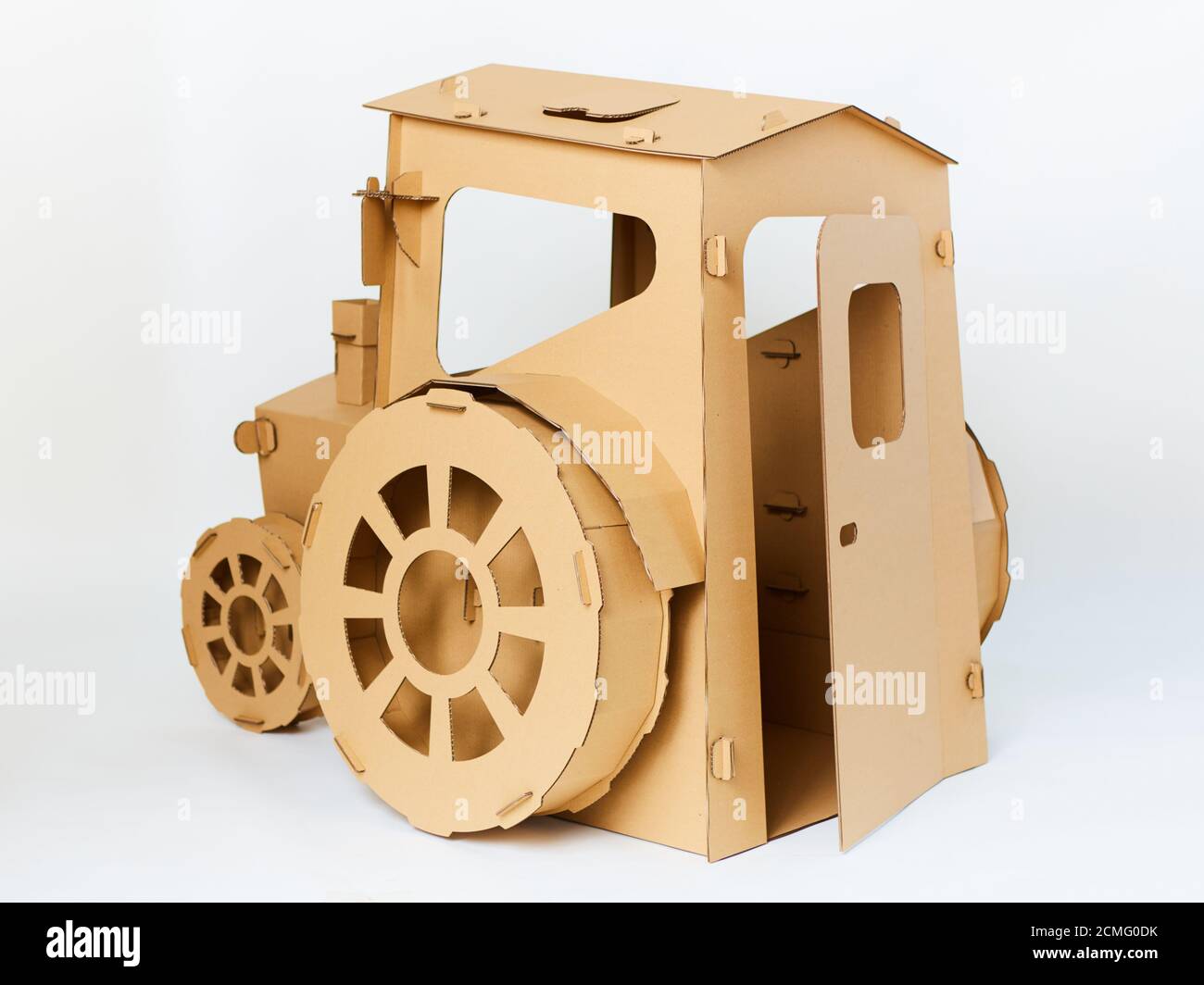 Cardboard tractor on a white background. Agriculture concept. Mockup ...