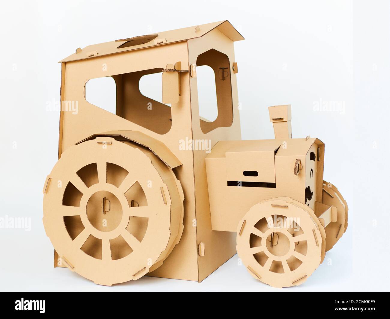 Cardboard tractor on a white background. Agriculture concept. Mockup ...