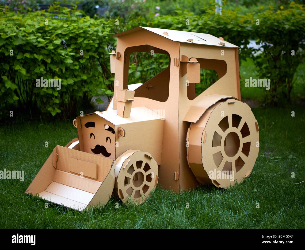 Cardboard tractor on a white background. Agriculture concept. Mockup ...