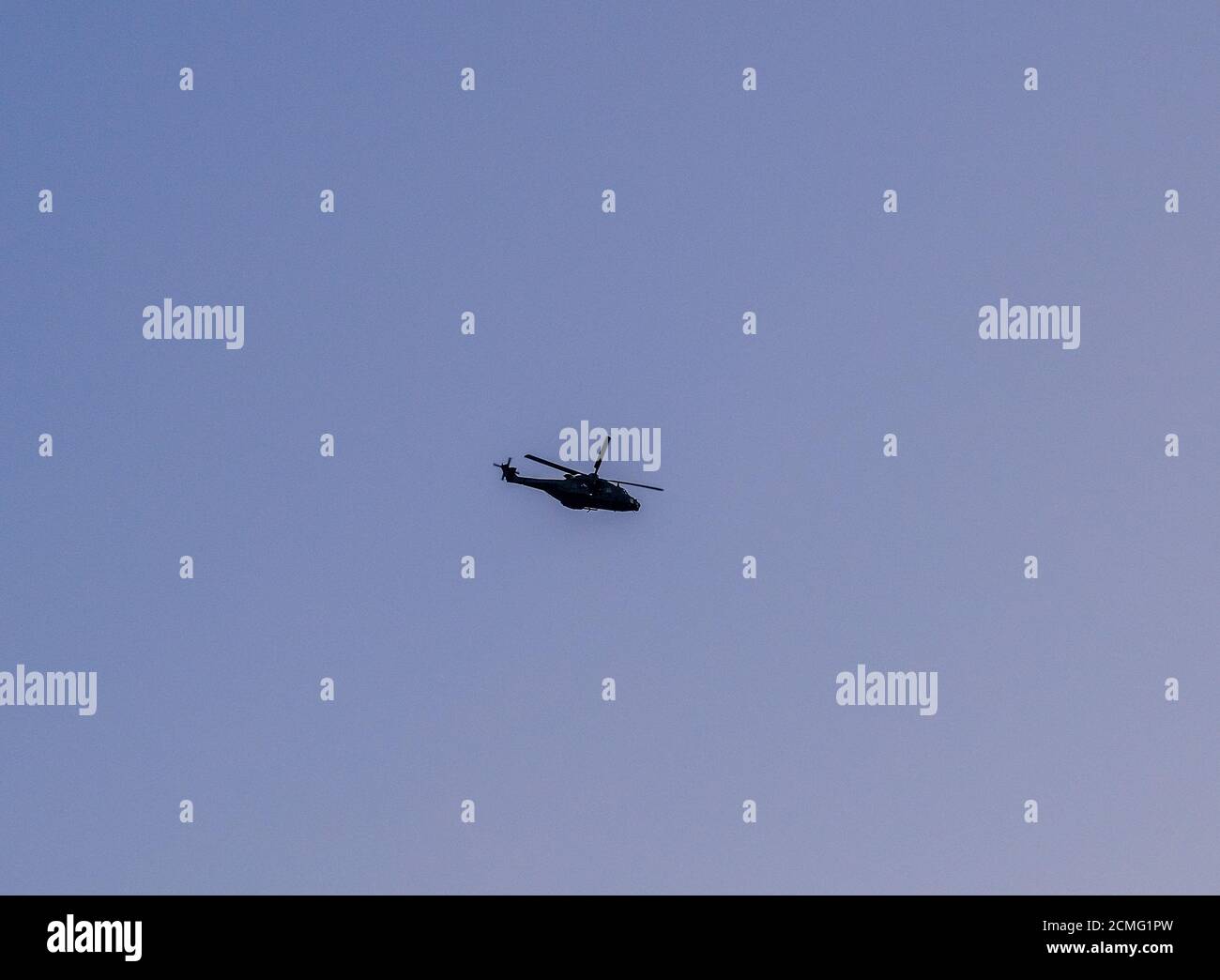 military helicopter flying in blue sky. High quality photo Stock Photo ...