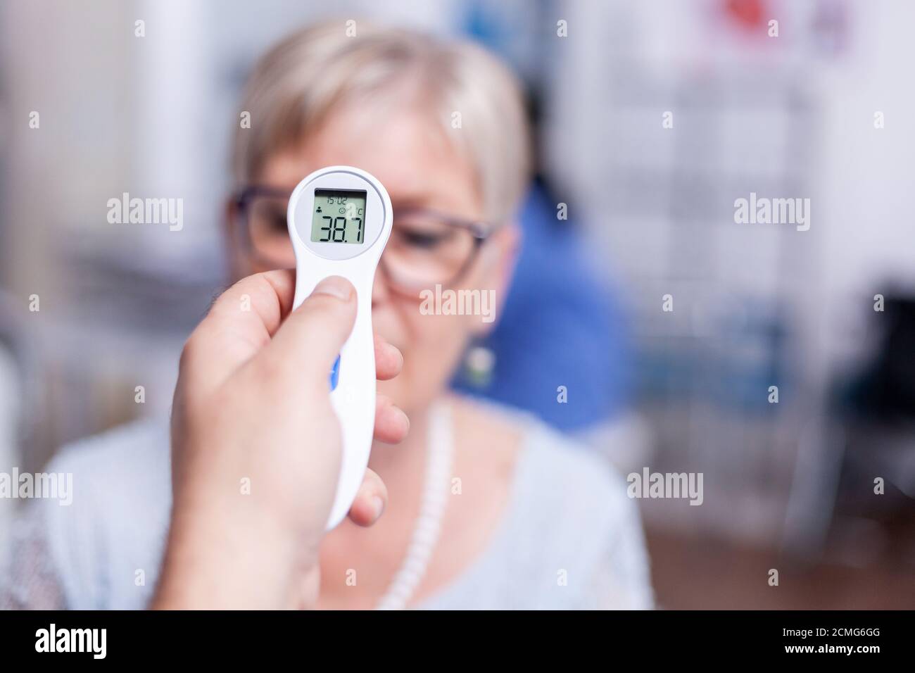 Reading body temperature using infrared thermometer during medical ...