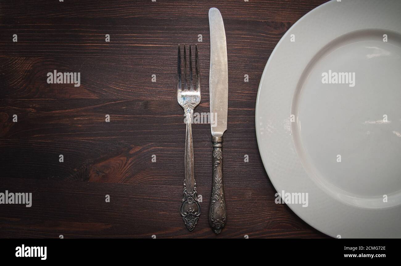 Half empty white plates Stock Photo - Alamy