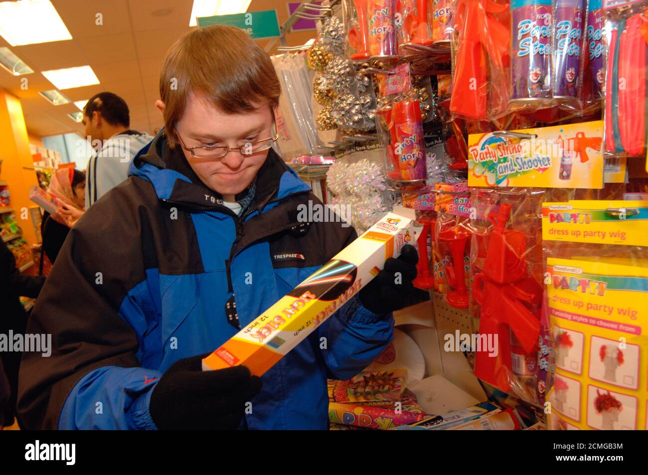 Group of men with learning disabilities shopping with carer; Bradford ...
