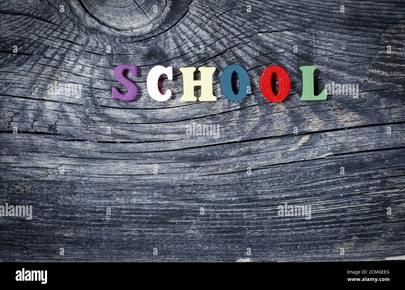 word school is laid out of small colored wooden letters Stock Photo - Alamy