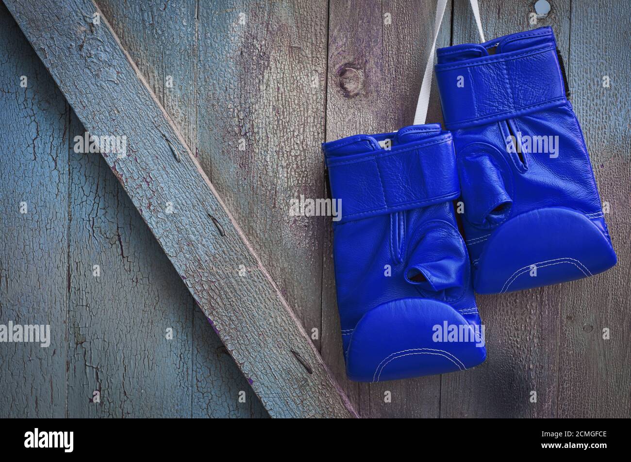 Blue leather hanging boxing gloves hi-res stock photography and images ...