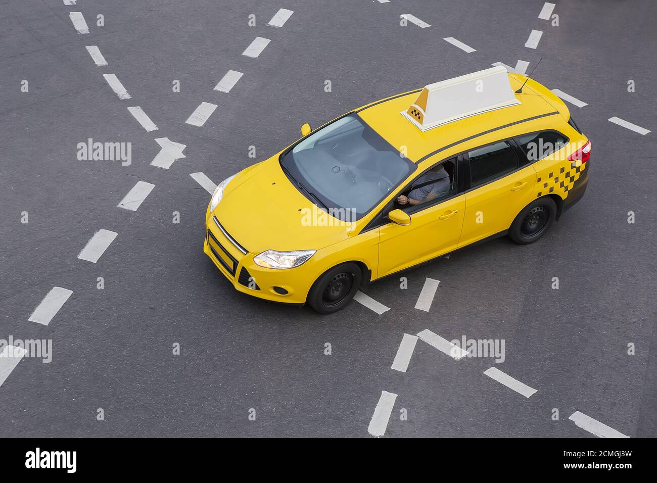 yellow taxi moves on the city street Stock Photo - Alamy