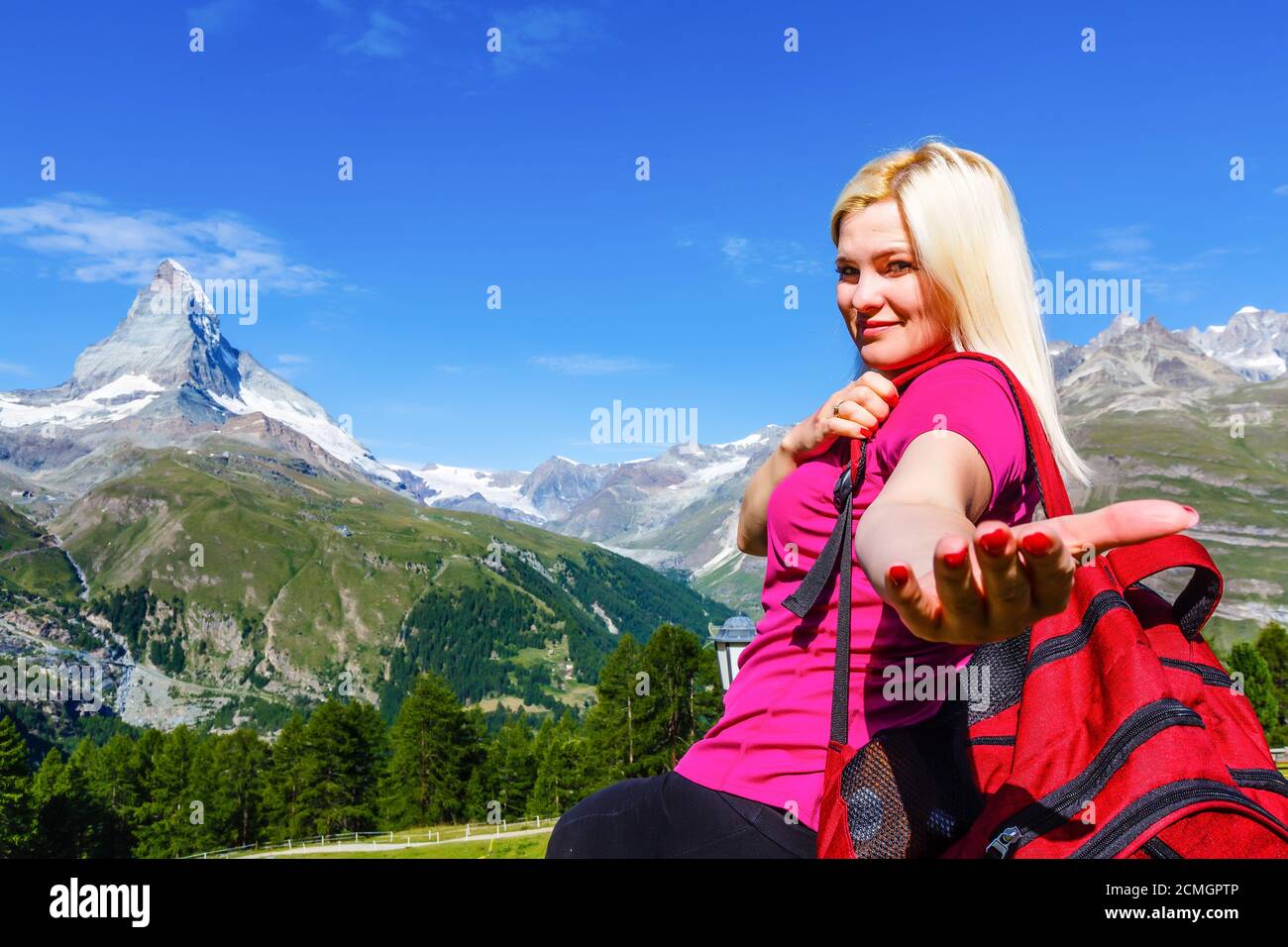 Woman hikers in the Alps, Matterhorn peak in Switzerland Stock Photo ...