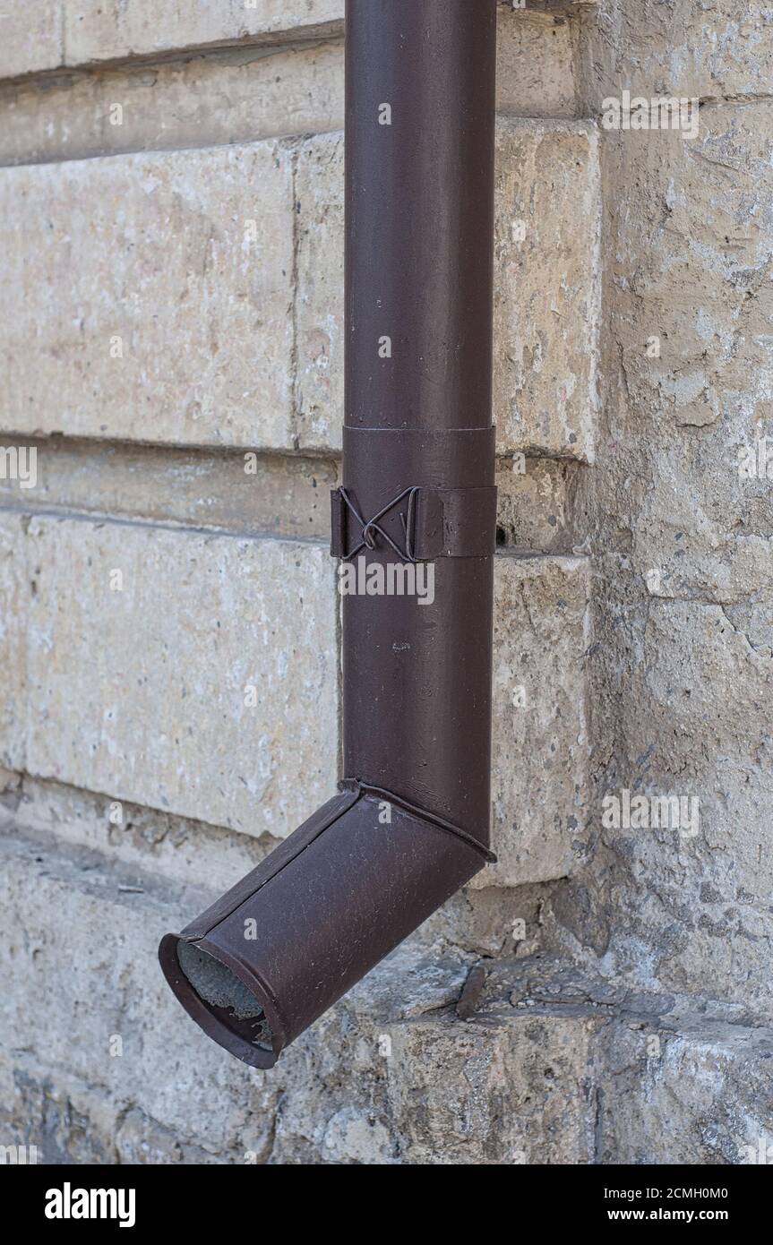 Metal brown pipe for a drain Stock Photo - Alamy