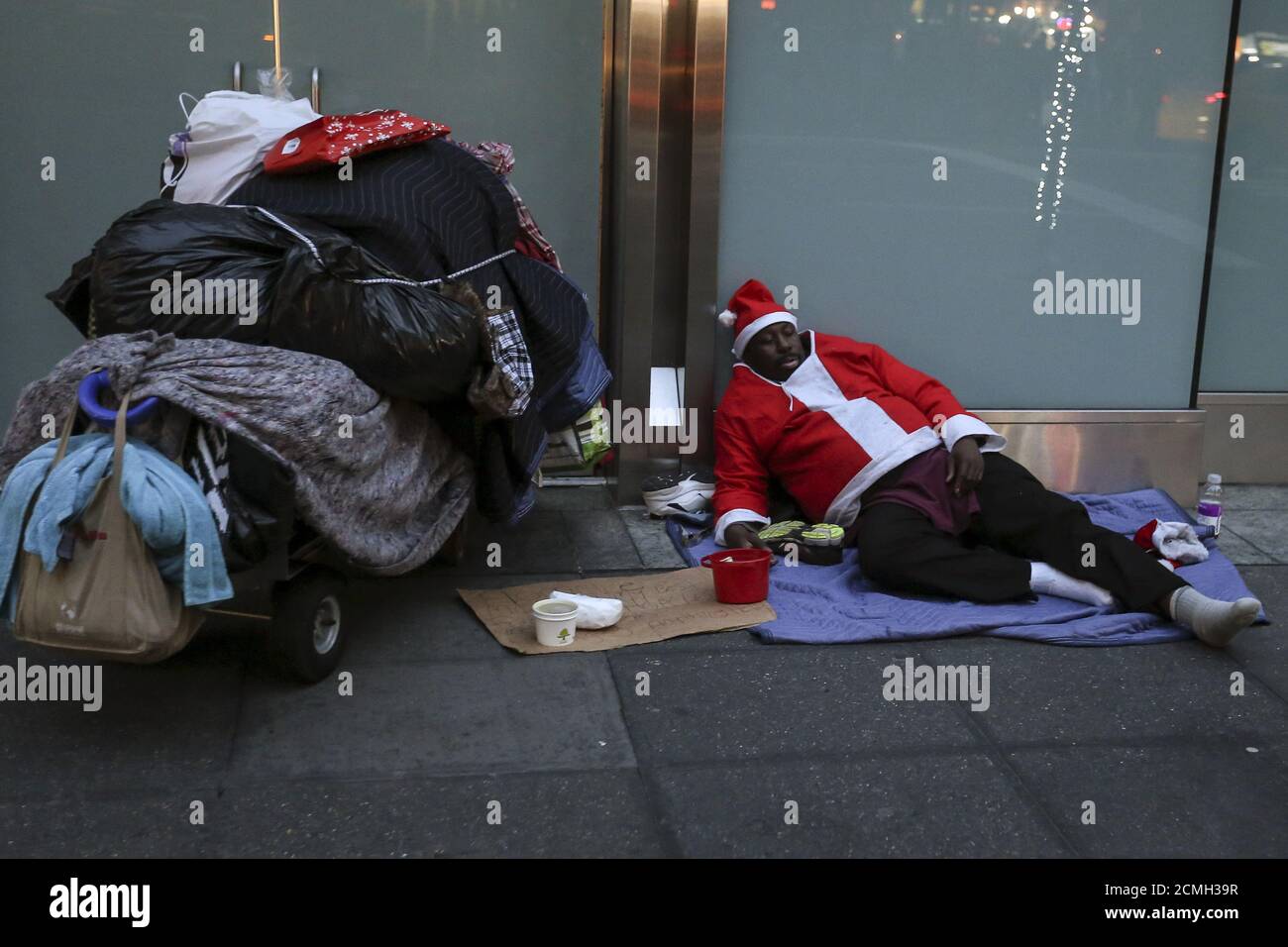 Homeless man dressed in santa hi-res stock photography and images - Alamy