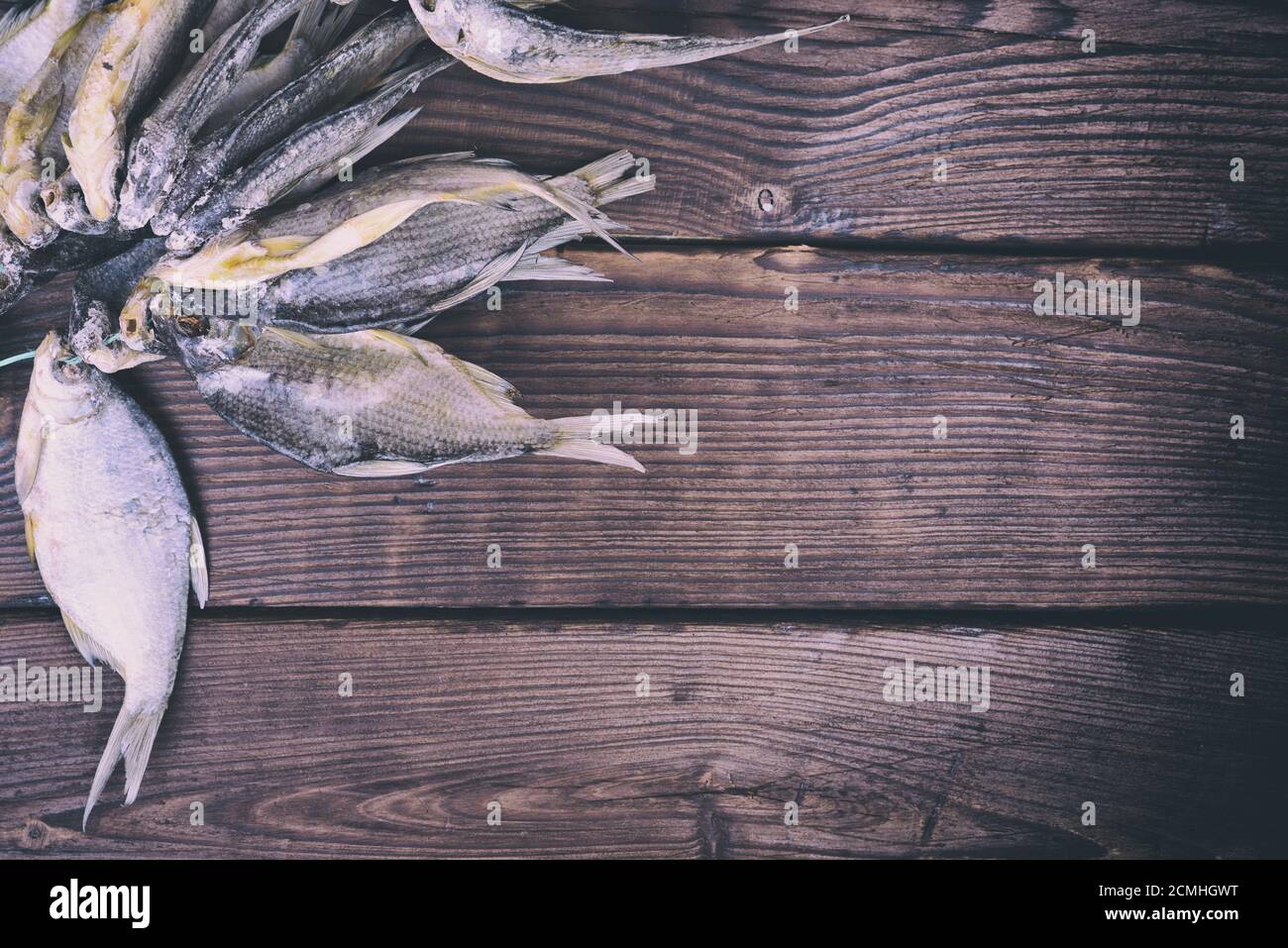 Dried fish tied on a rope Stock Photo - Alamy