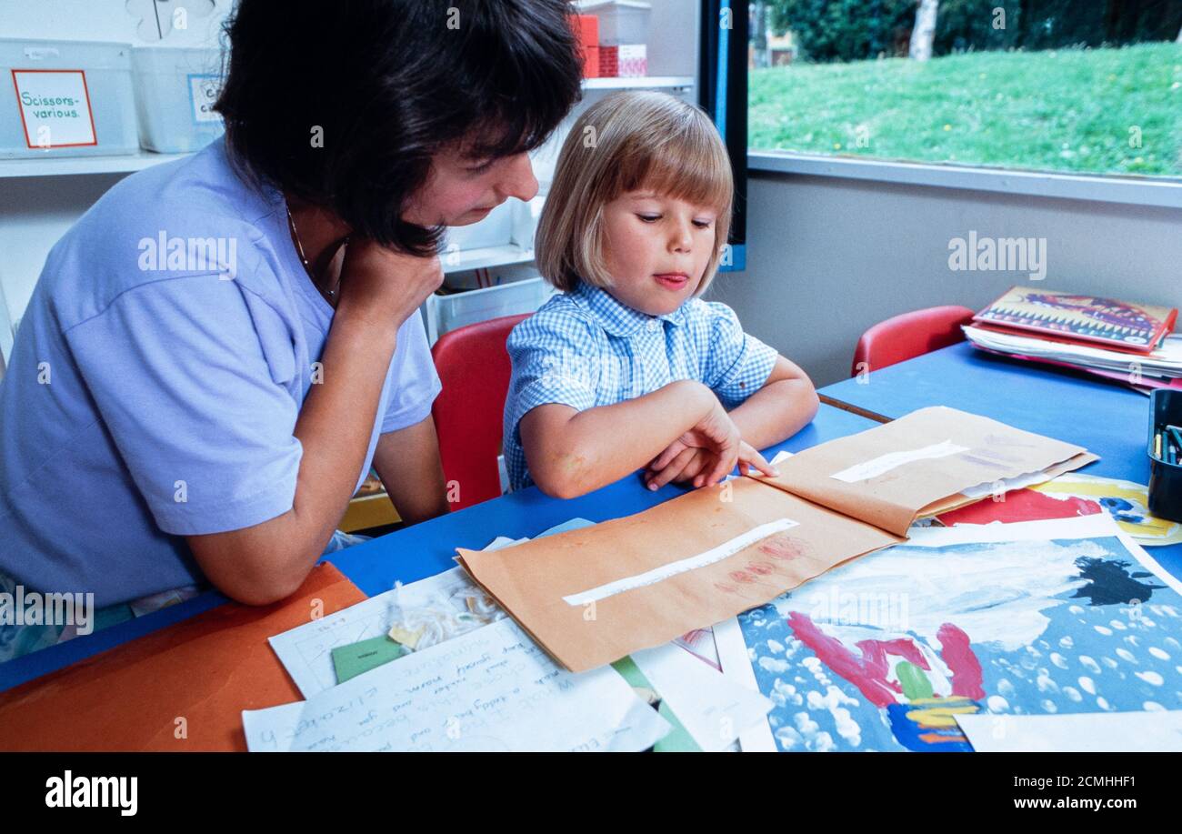 Parent and child woking together on assessment tasks as part of a new ...