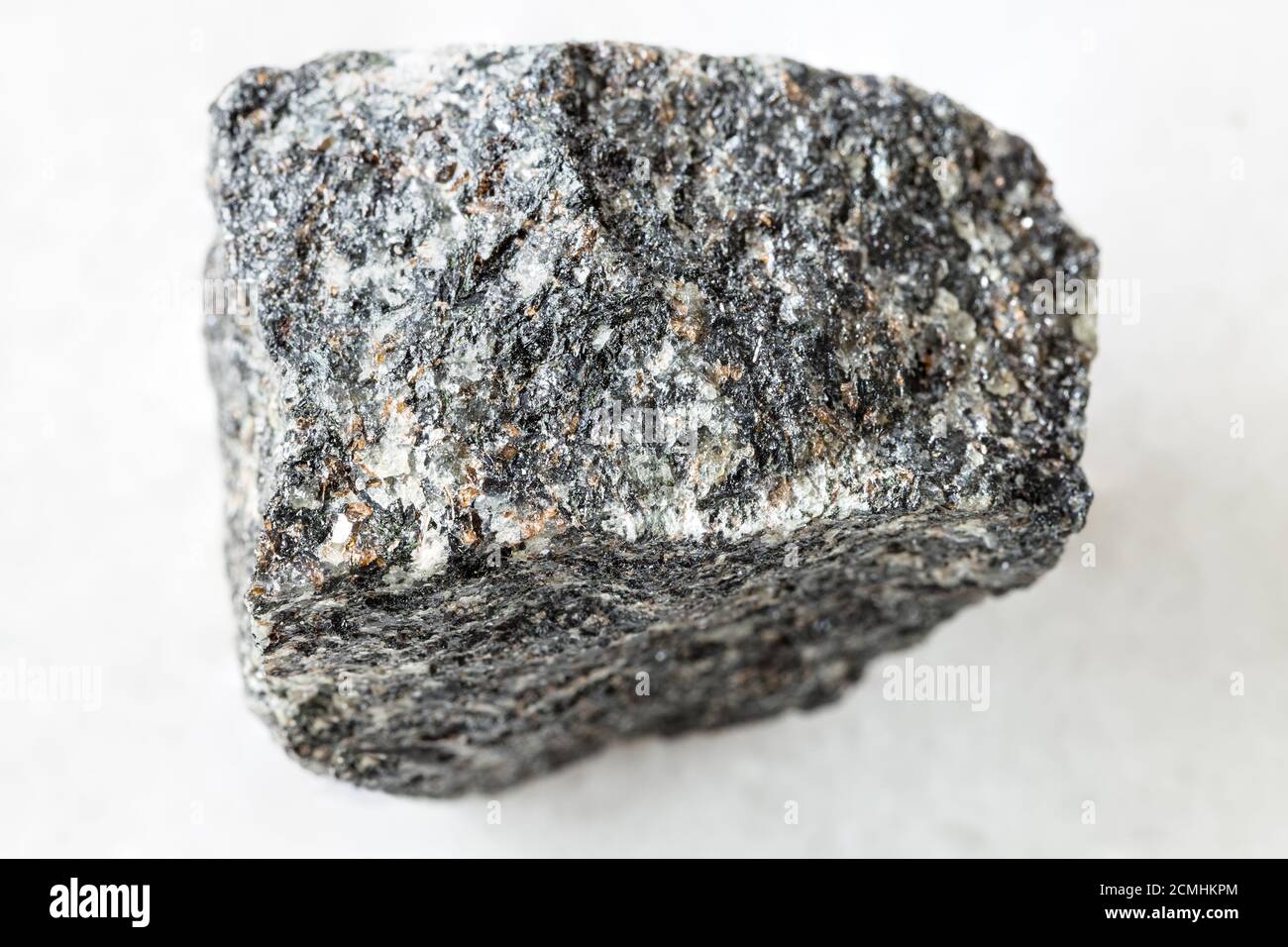 closeup of sample of natural mineral from geological collection - unpolished Nepheline Syenite ...