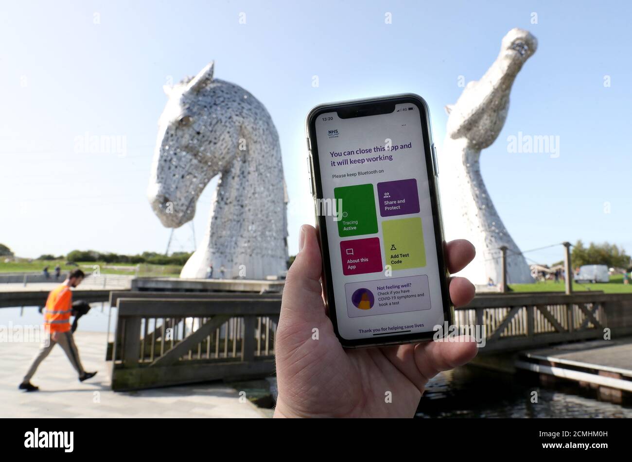 The Protect Scotland app from NHS Scotland is visible on a phone at the ...