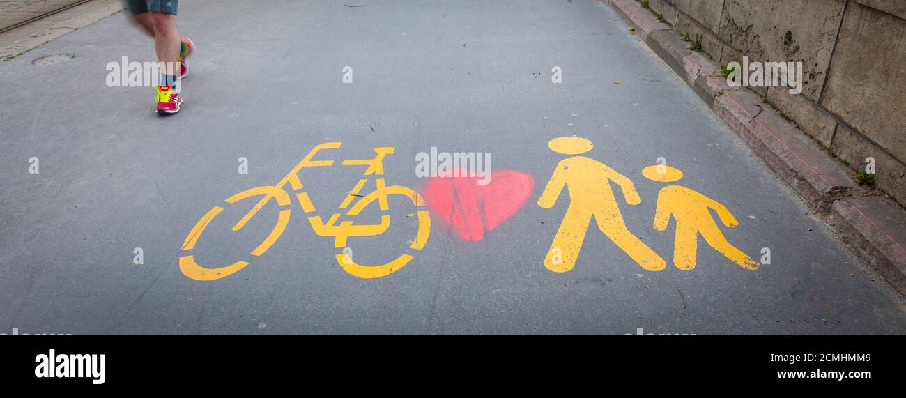 Bicycle signs painted on asphalt Stock Photo - Alamy