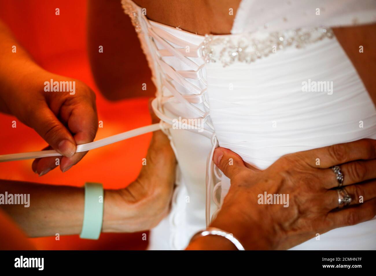 dressing the bride, lacing the bodice dress. High quality photo Stock ...