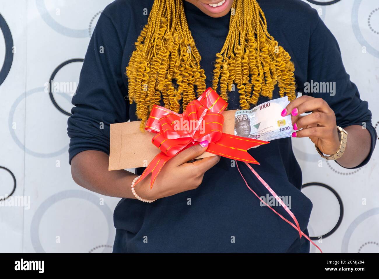 Envelope banknotes ribbon gift money hi-res stock photography and ...