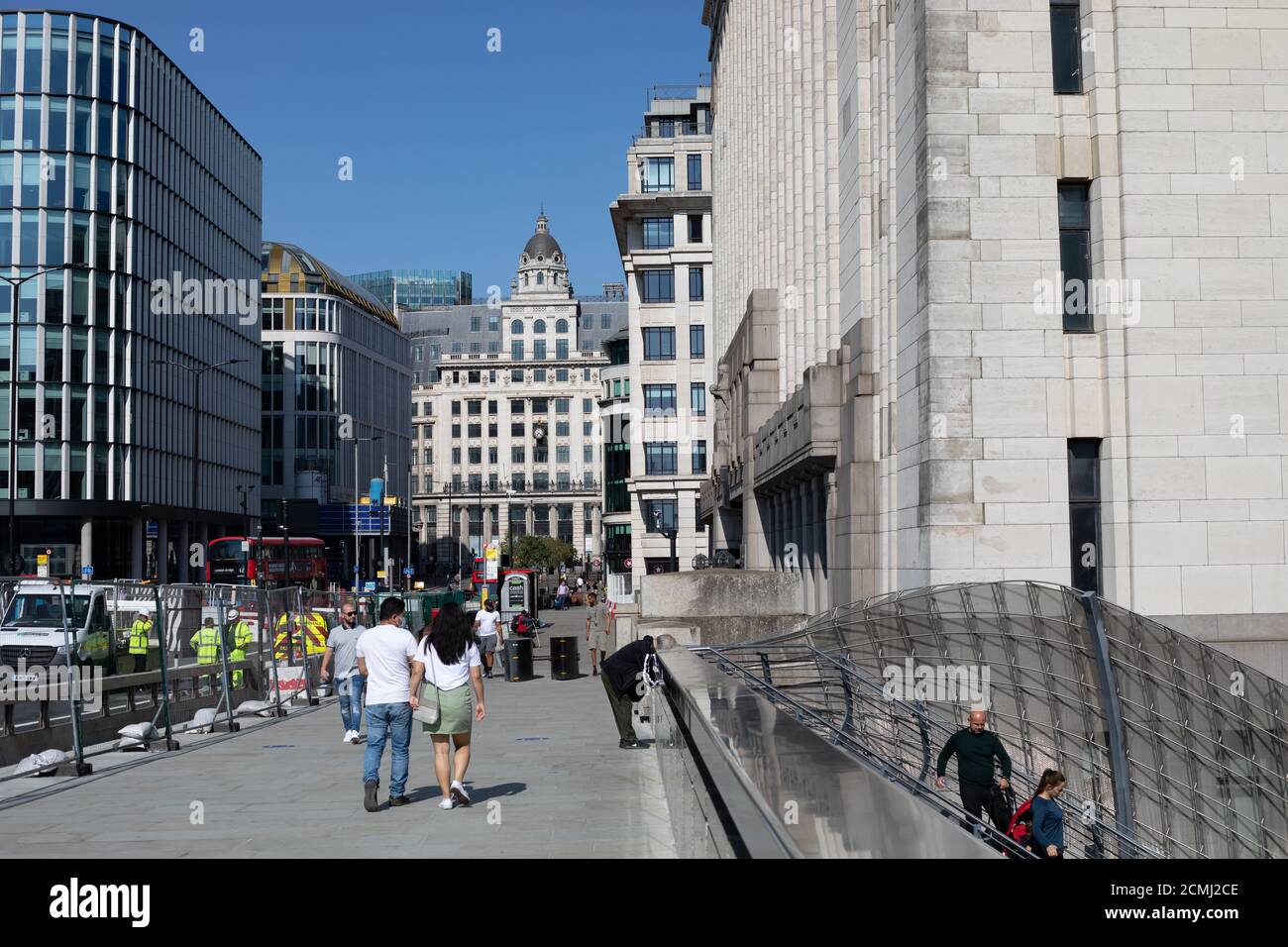 People walking across Historic London Bridge in London Stock Photo - Alamy
