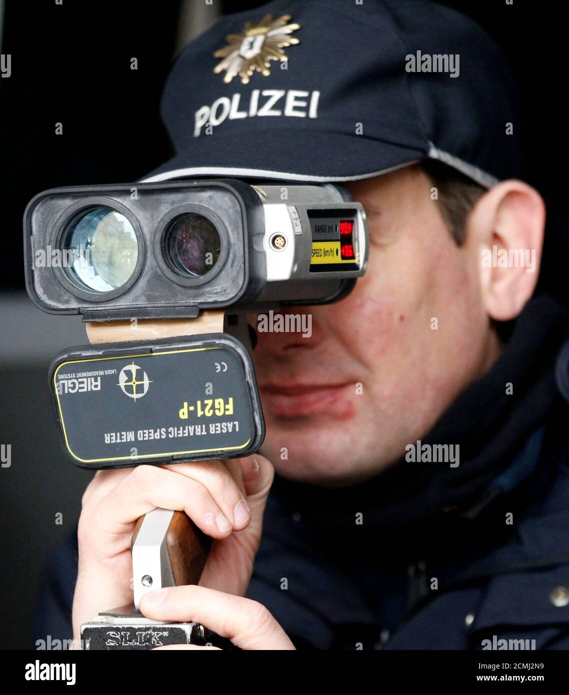 Man with radar speed gun hi-res stock photography and images - Alamy