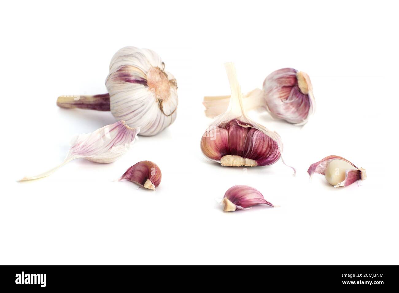 Young cracked garlic on a clean white background Stock Photo - Alamy