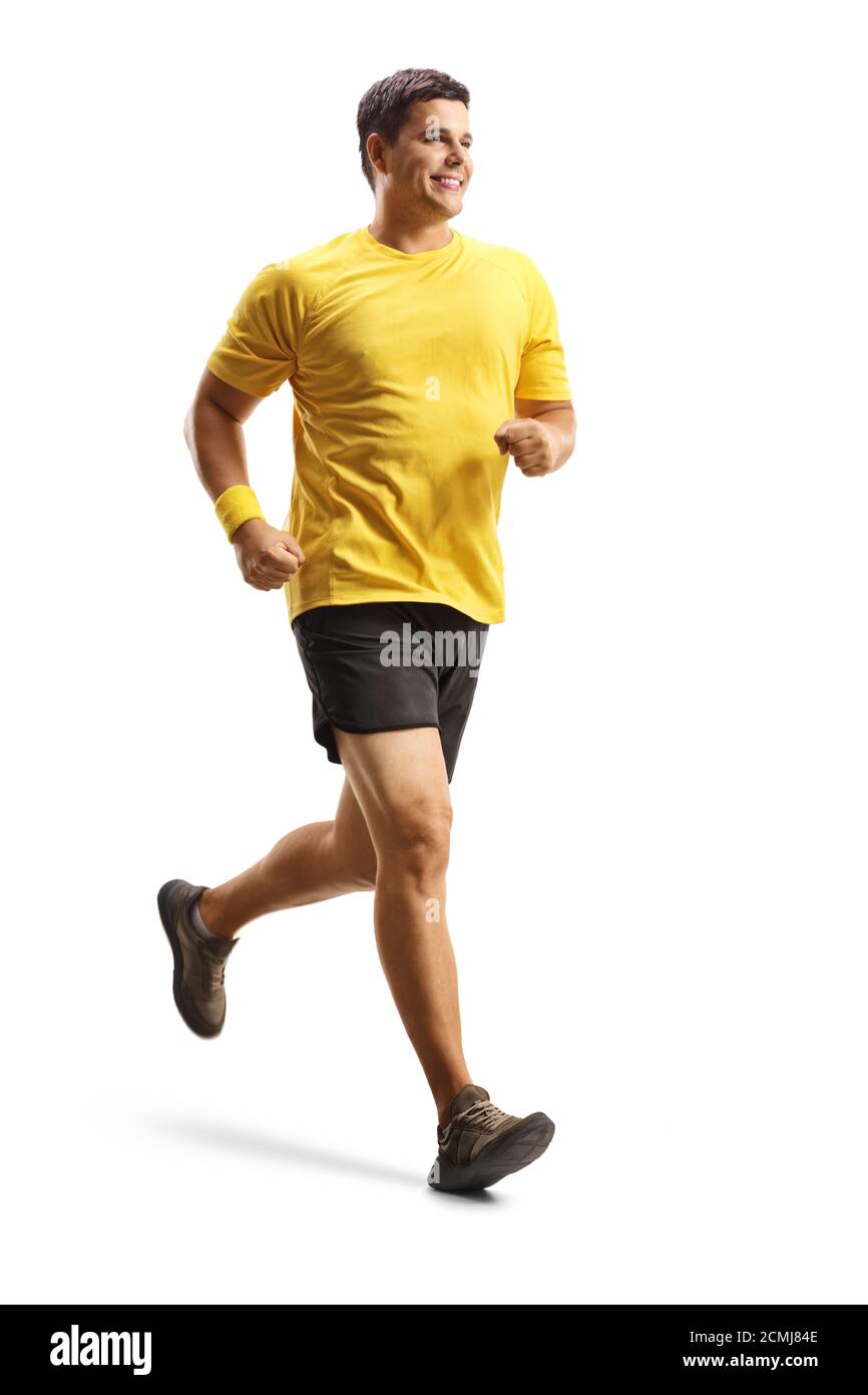 Man Running In Yellow Shirt High Resolution Stock Photography and ...