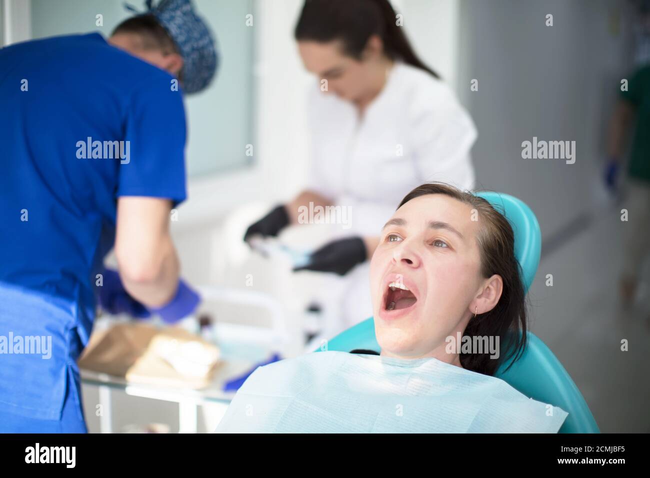 Dental treatment. Dental office. Doctor treats teeth. Woman in ...