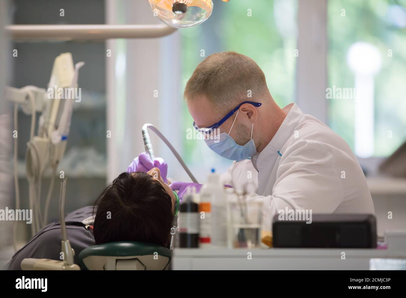 Dental office. Dentist doctor treats teeth Stock Photo - Alamy