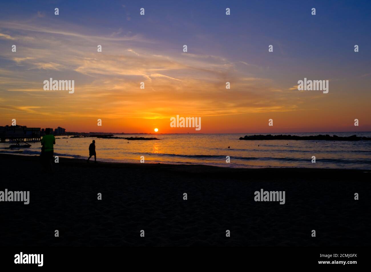 rimini beach beautiful sunset with bright colors and sea Stock Photo ...