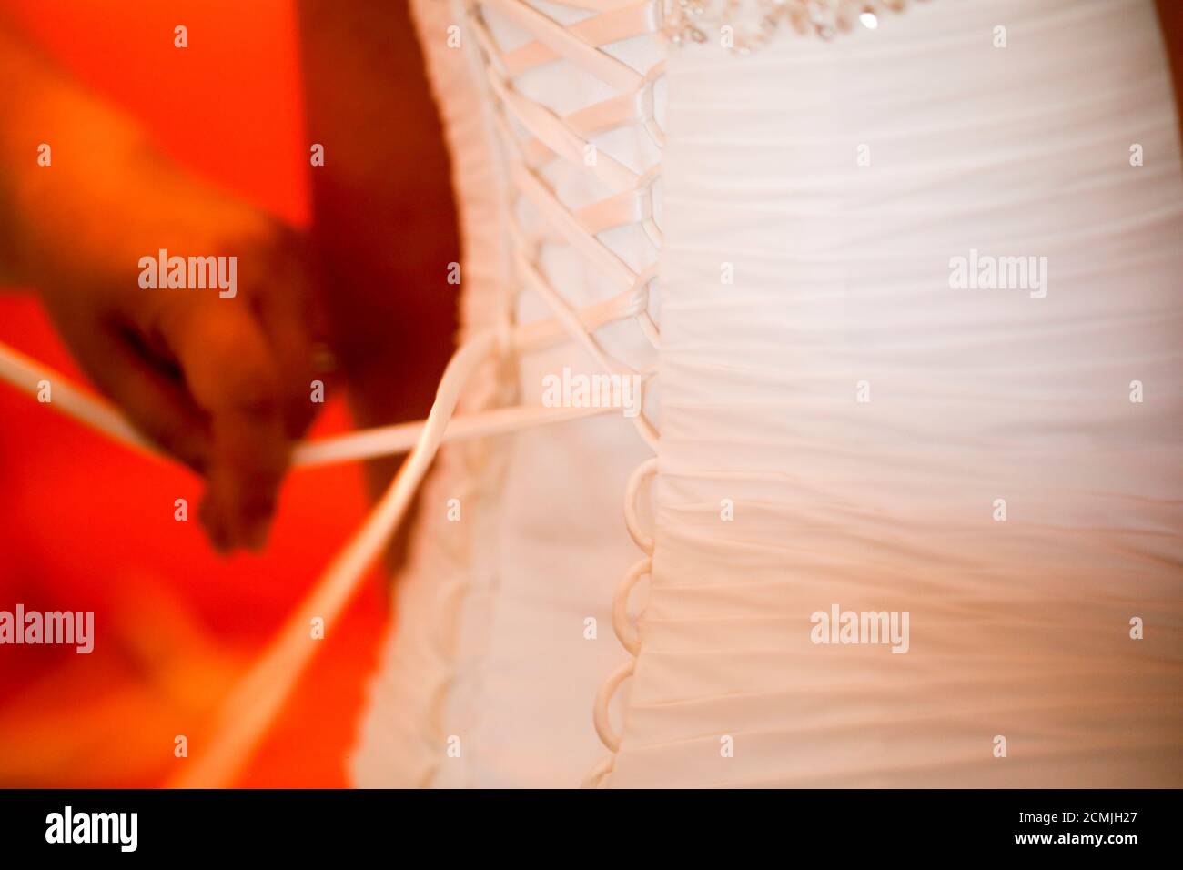 dressing the bride, lacing the bodice dress. High quality photo Stock ...