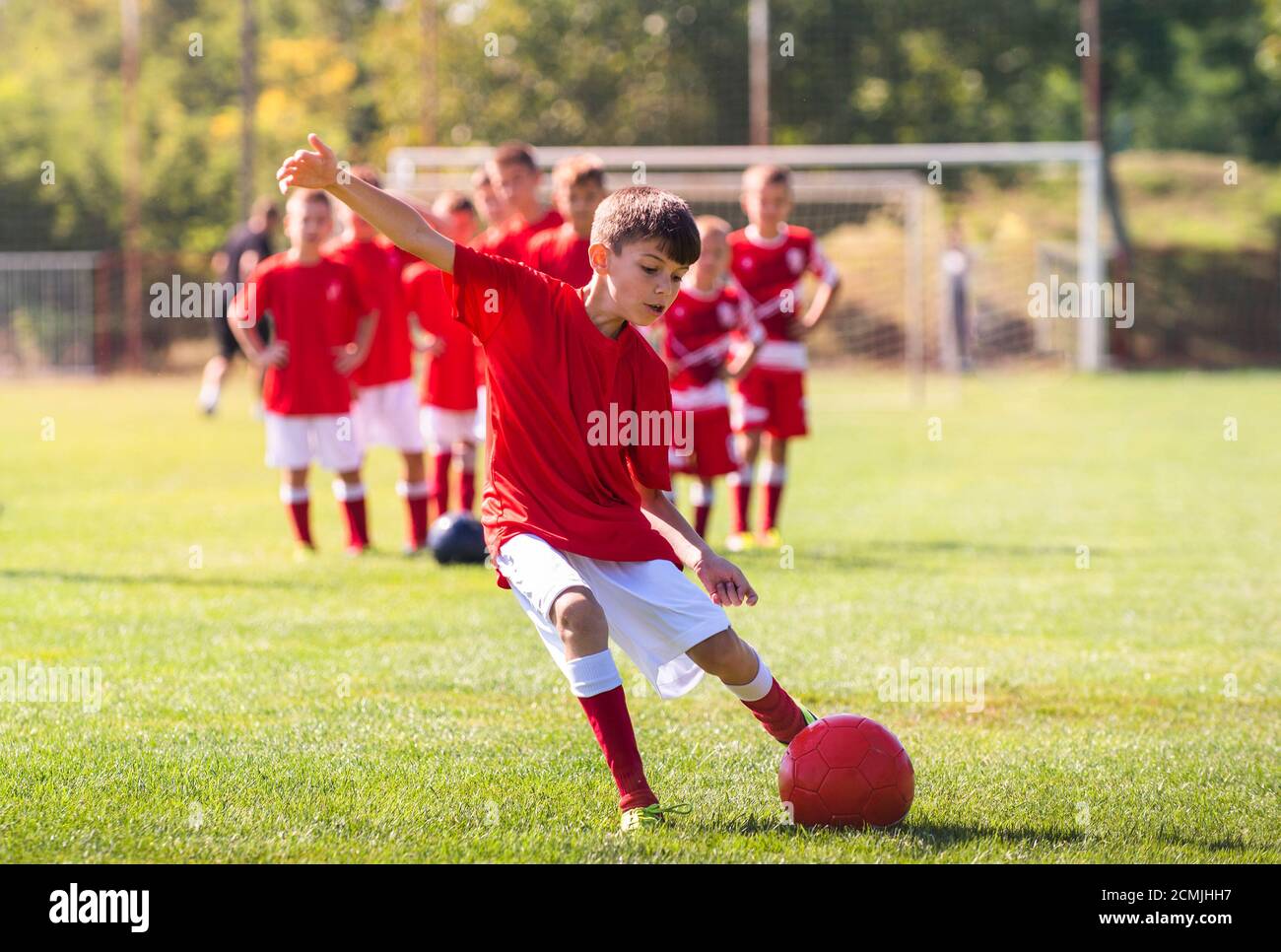 Young boy shooting ball. Action, competition Stock Photo - Alamy
