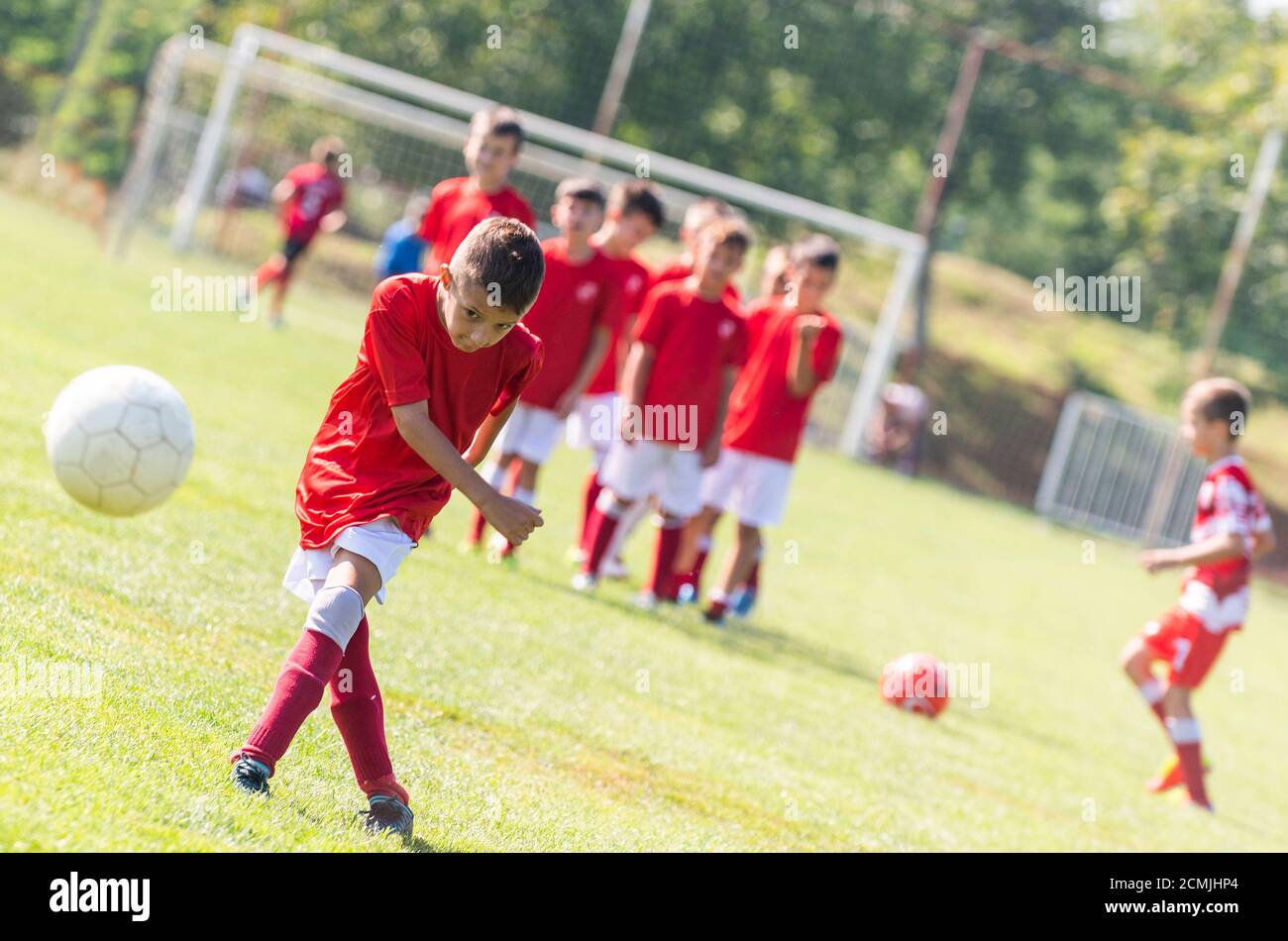 Young boy shooting ball. Action, competition Stock Photo - Alamy
