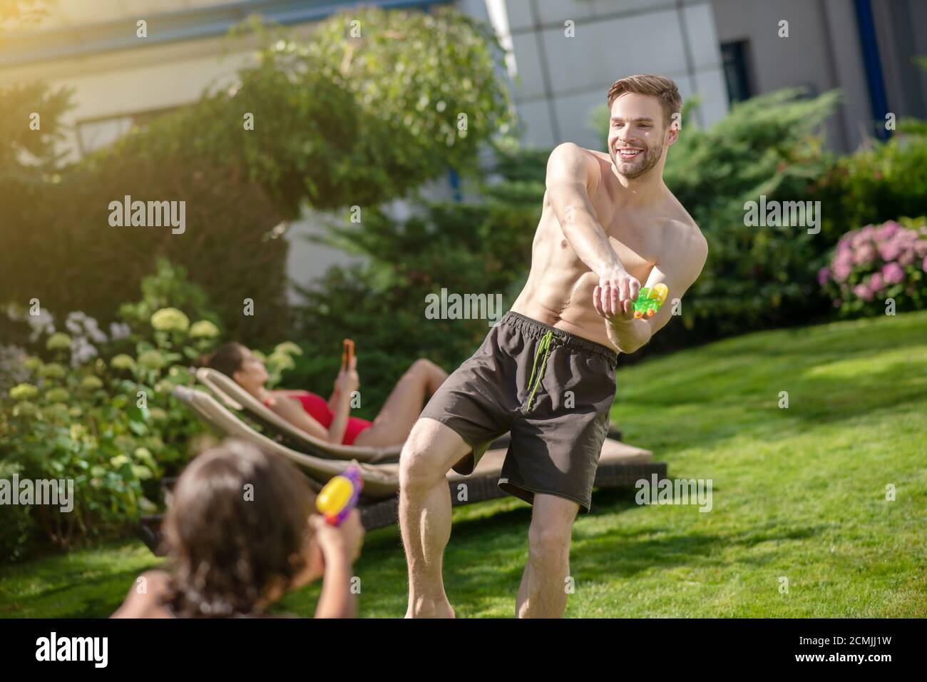 Man water gun hi-res stock photography and images - Alamy