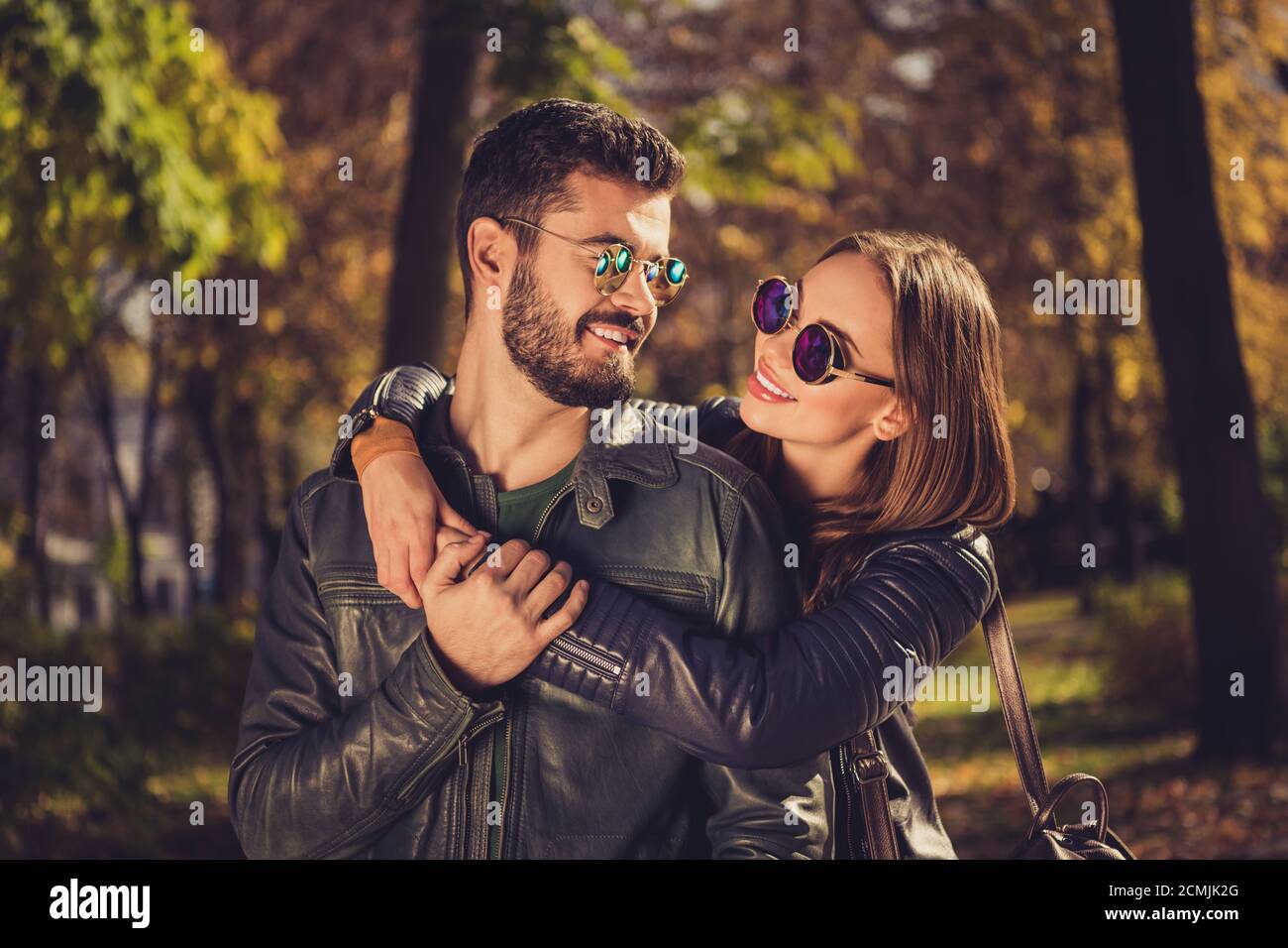 Photo of charming, positive soulmates girl hug her boyfriend in ...