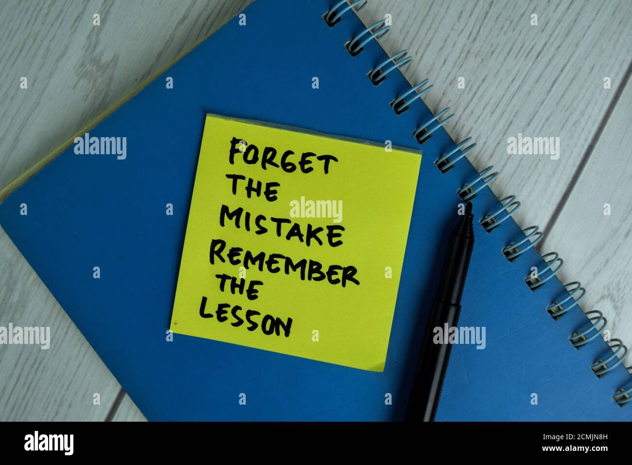 Forget The Mistake Remember The Lesson write on sticky notes isolated ...