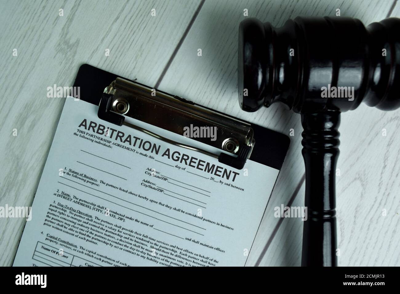 Arbitration Agreement Document form and Black Judges gavel on office ...