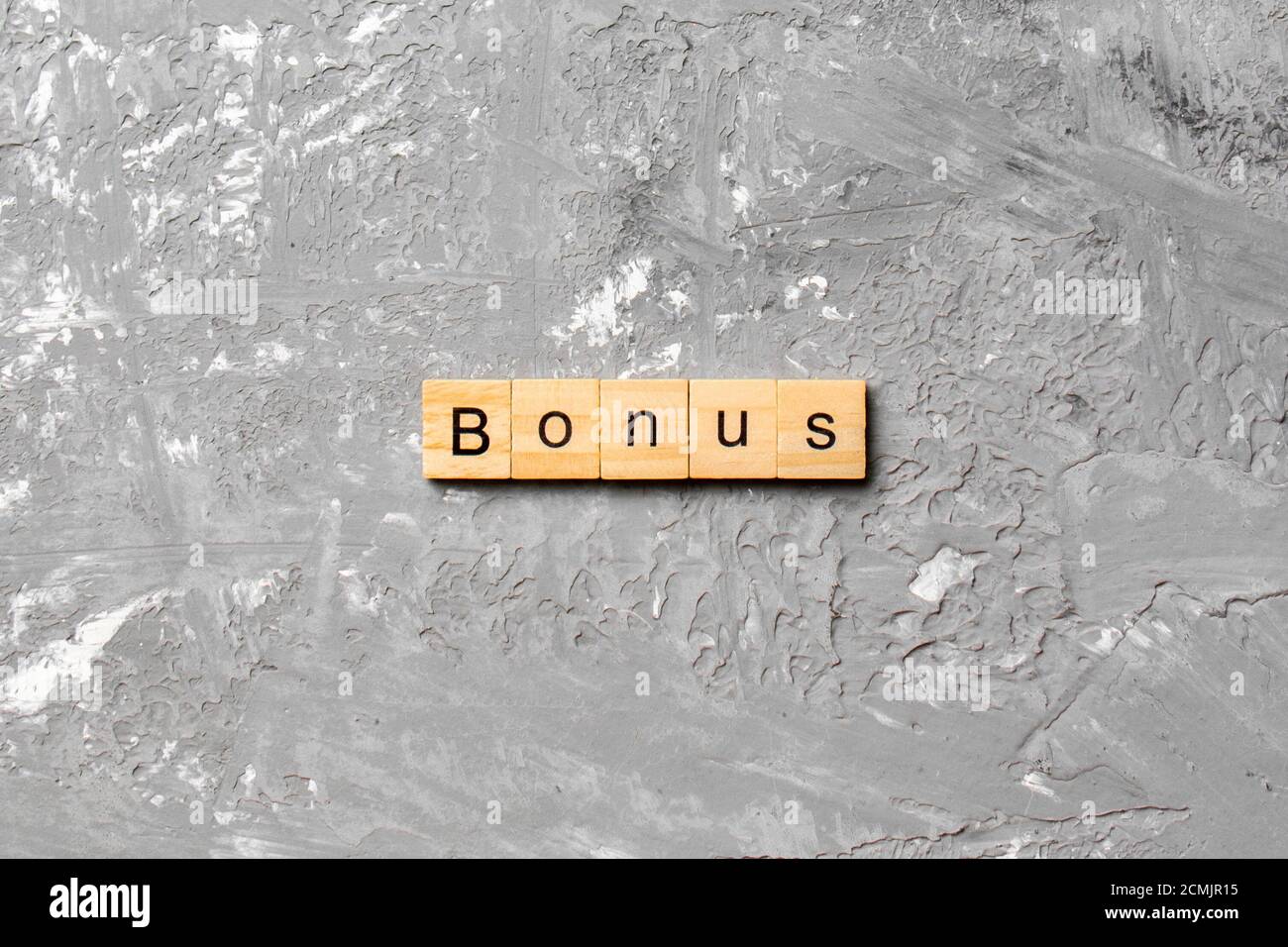 bonus word written on wood block. bonus text on table, concept Stock ...