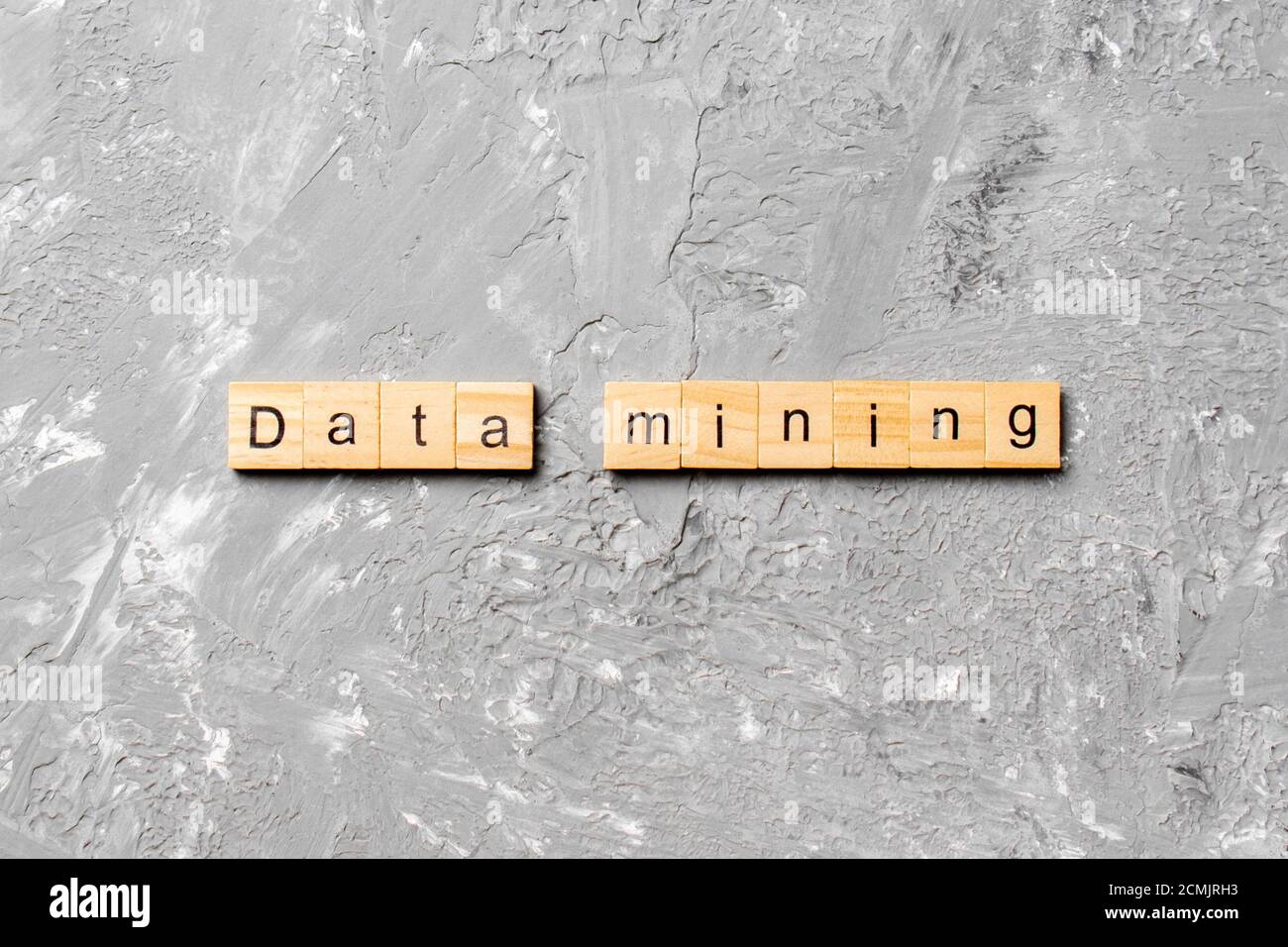 Data mining word written on wood block. Data mining text on cement ...