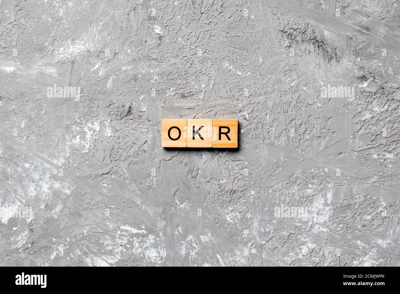 OKR word written on wood block. abbreviation of Objective Key Results ...